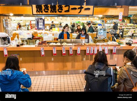 Fast Food Counter Selling Traditional Japanese Snacks With Menu Tickets