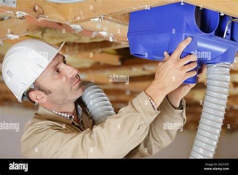 Man Installing An Air Conditioning Unit Stock Photo Alamy