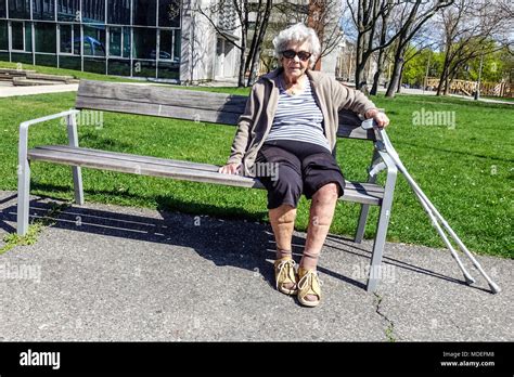 Old Person Sitting On A Park Bench Two Old People Sitting On A Bench