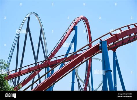 Inverted Roller Coaster With Narrow Metal Rails An Ideal Summer Day To