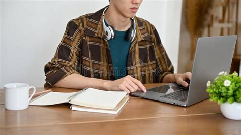 A Smart Young Asian Man Programmer Or Tech Engineer Using Laptop Computer Stock Image Image Of
