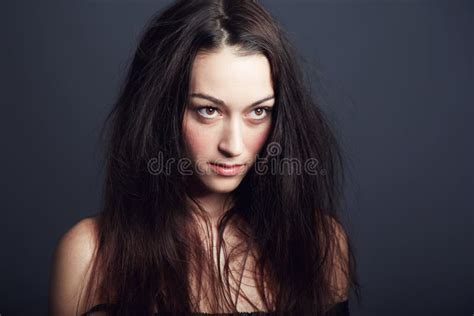 A Hypnotizing Stare A Beautiful Brunette Looking Ahead Of Her With A