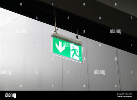 Emergency Exit Or Fire Escape Sign With Green Running Man Symbol And