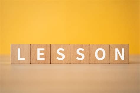 Premium Photo Wooden Blocks With Lesson Text Of Concept