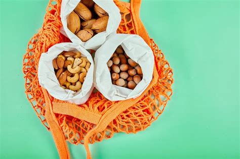 Premium Photo Top View Of Various Sort Of Nuts On The Table In A Paper Bag In Shopping Grocery