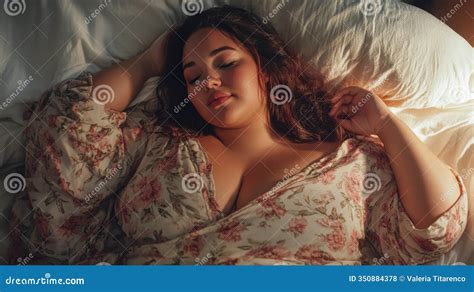 Curvy Woman Sleeping Peacefully In Bed Enjoying Restful Night Stock
