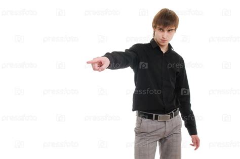 Фотография на тему Молодой человек показывает пальцем на белом фоне Pressfoto