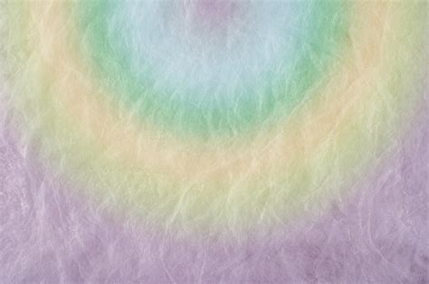 직물의 질감 배경입니다 면은 분홍색 노란색 연 보라색 녹색 텍스트 공간입니다 패브릭 질감의 클로즈업입니다 트렌드 색상 석 영