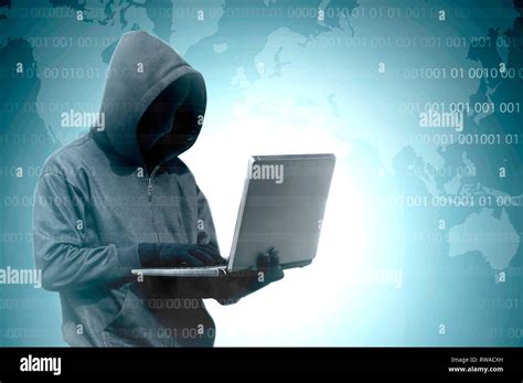 Hacker In Black Hoodie Holding Laptop With Binary Code On Virtual Screen And World Map