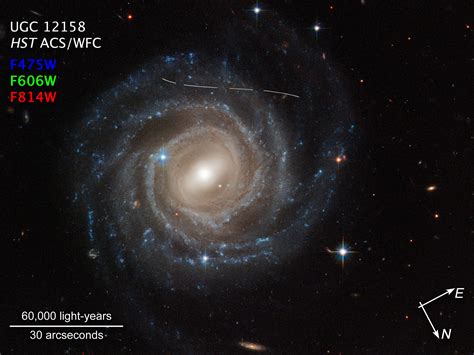 Asteroid Photobombs Hubble Snapshot Of Galaxy Ugc 12158 Compass Image