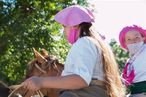 Premium Photo Girls Riding Horses Against Tree