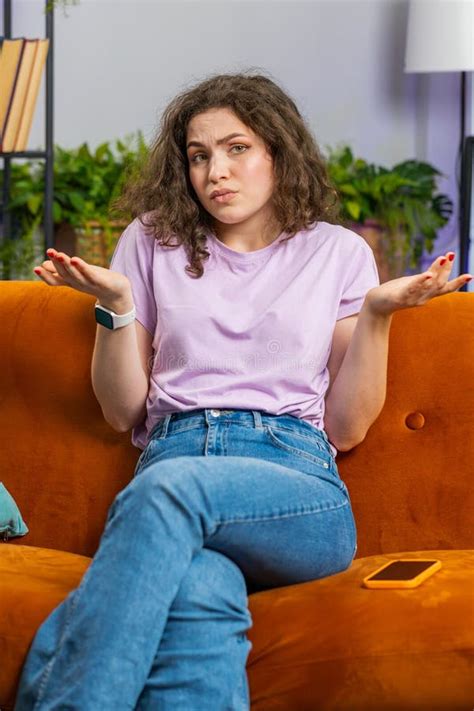 Confused Young Woman Feeling Embarrassed About Ambiguous Question Having Doubts No Idea No