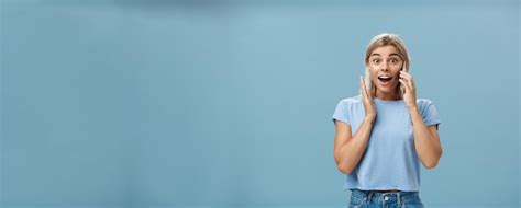 Free Photo Pleased To Hear Best Friend Calling From Abroad Portrait Of Surprised Pleased