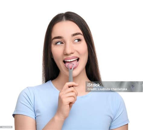 Happy Woman Brushing Her Tongue With Cleaner On White Background Stock
