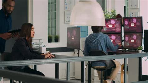 Multiethnic Team Of Coders Encountering System Error Message On Computer Technology Stock