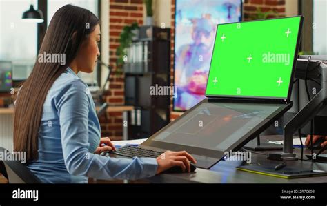 Female Office Worker Using Game Developing Interface And Greenscreen