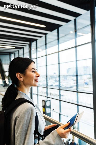 Girl Checking Flight Number Online In The Airport Terminal Using Her Smartphone Journey And