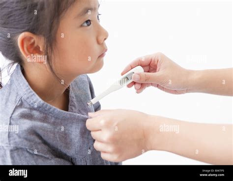 A Girl Checking Her Temperature Stock Photo Alamy