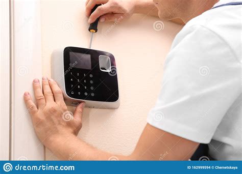 Male Technician Installing Security Alarm System Indoors Stock Photo Image Of Office Person