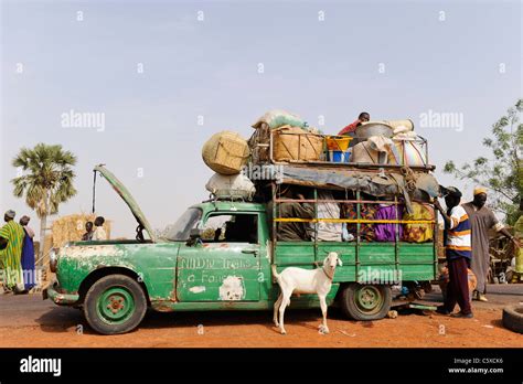 Africa MALI Mopti People In Old Peugeot Car Which Works As A Public