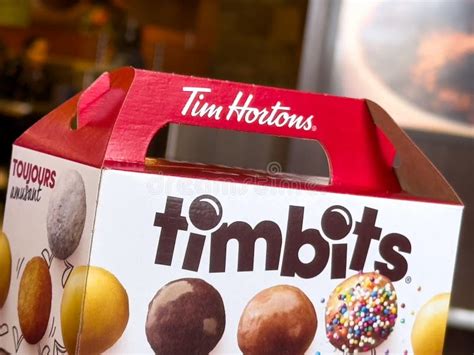 A Close Up Shot Of A Red And White Tim Hortons Timbits Box Showcasing
