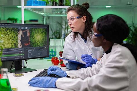 Biologists With Diverse Backgrounds Analyzing Plant Experiment On Computer Photo And Picture For