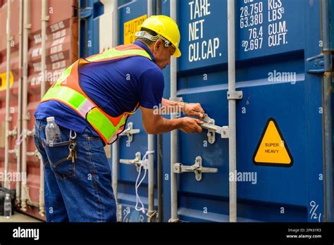 Logistics Worker Opening And Closing Door Of Container Box At Container