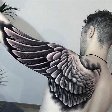 Angel Wing Tattoo On Back And Arm Angel Wings Tattoo On Back Men Tatoos