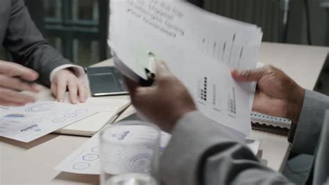 Passing Files To Business Partner During Meeting Business Corporate