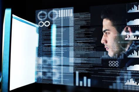 Technology At His Beck And Call A Young Hacker Cracking A Computer Code In The Dark Stock