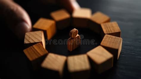 Wooden Blocks With Person Icons In A Circular Arrangement Representing Teamwork And Unity High