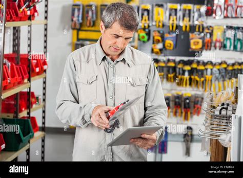 Man Scanning Product Through Digital Tablet Stock Photo Alamy