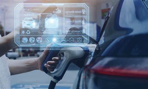 Hand Plugging In A Charger In An Electric Car Socket Electric Car Or Ev Is Charging At Station