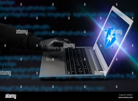 A Cybercriminal Breaking The Security System Of A Laptop To Scam Online