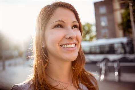 Premium Photo Smiling Pretty Redhead On A Sunny Day