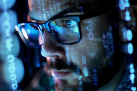 Young Programmer Coding On A Computer Surrounded By Glowing Code And