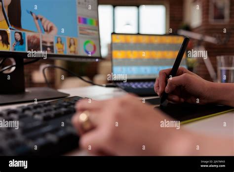 Female Editor Using Stylus On Graphic Tablet To Retouch Photo Creating