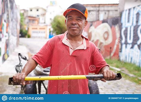 Keeping His City Clean Portrait Of A Garbage Collector With His Cart In The Streets Of Brazil