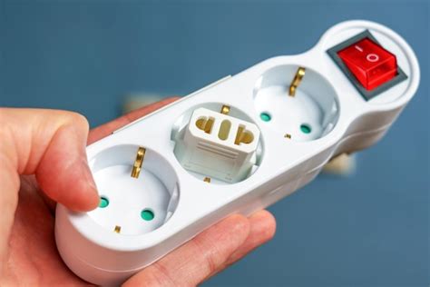 Premium Photo Electrical Plug Adapter In A European Splitter Socket In A Hotel Room Close Up