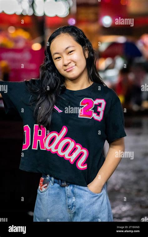A Young Pretty Filipino Girl Poses And Smiles For Her Portrait In The