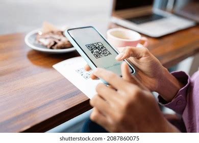 Woman Scanning Qr Code Through Mobile Stock Photo Shutterstock