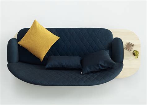 Side Table Extends From Base Of Rise Sofa By Note Design Studio