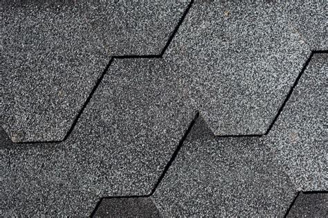 Closeup Of Gray Asphalt Roof Shingles Texture Roof Covered By Hexagonal Soft Shingles Or Tiles