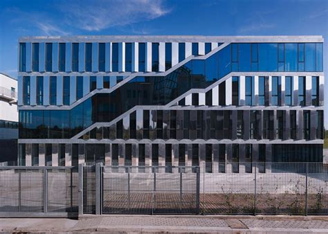 Staircases Cut Paths Across Glazed Facade Of Rome Office Block
