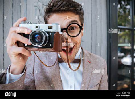 Happy Funny Stylish Nerd Holding Camera Outdoors Stock Photo Alamy