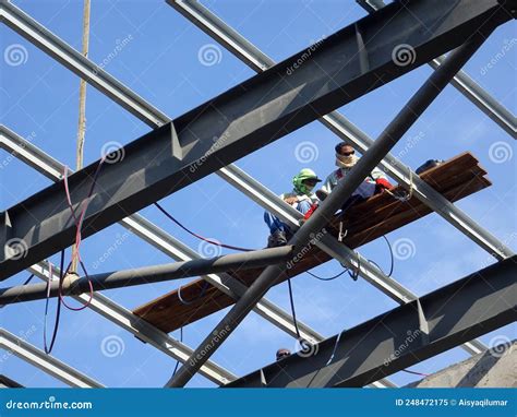 Metal Roof Trusses Installed By Construction Workers Editorial Image