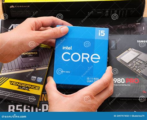 Woman Hands Holding Box With An Intel Core I CPU Over Other Boxes With Brand New