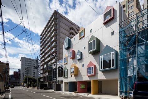Colourful House Shaped Boxes Surround Windows At Nursery School