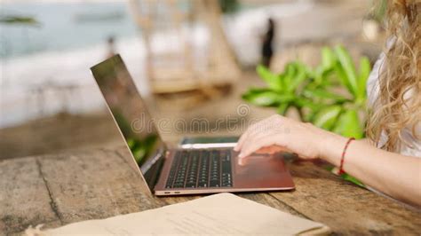 Hands Of Young Woman Coding On Laptop In Outdoor Seaside Cafe Female Freelancer Typing On