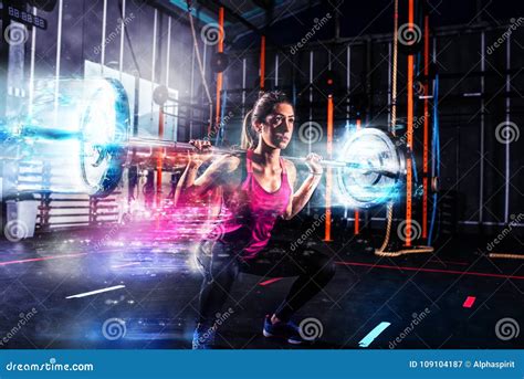 Athletic Girl Works Out At The Gym With A Barbell With Blue Energy Effects Stock Image Image